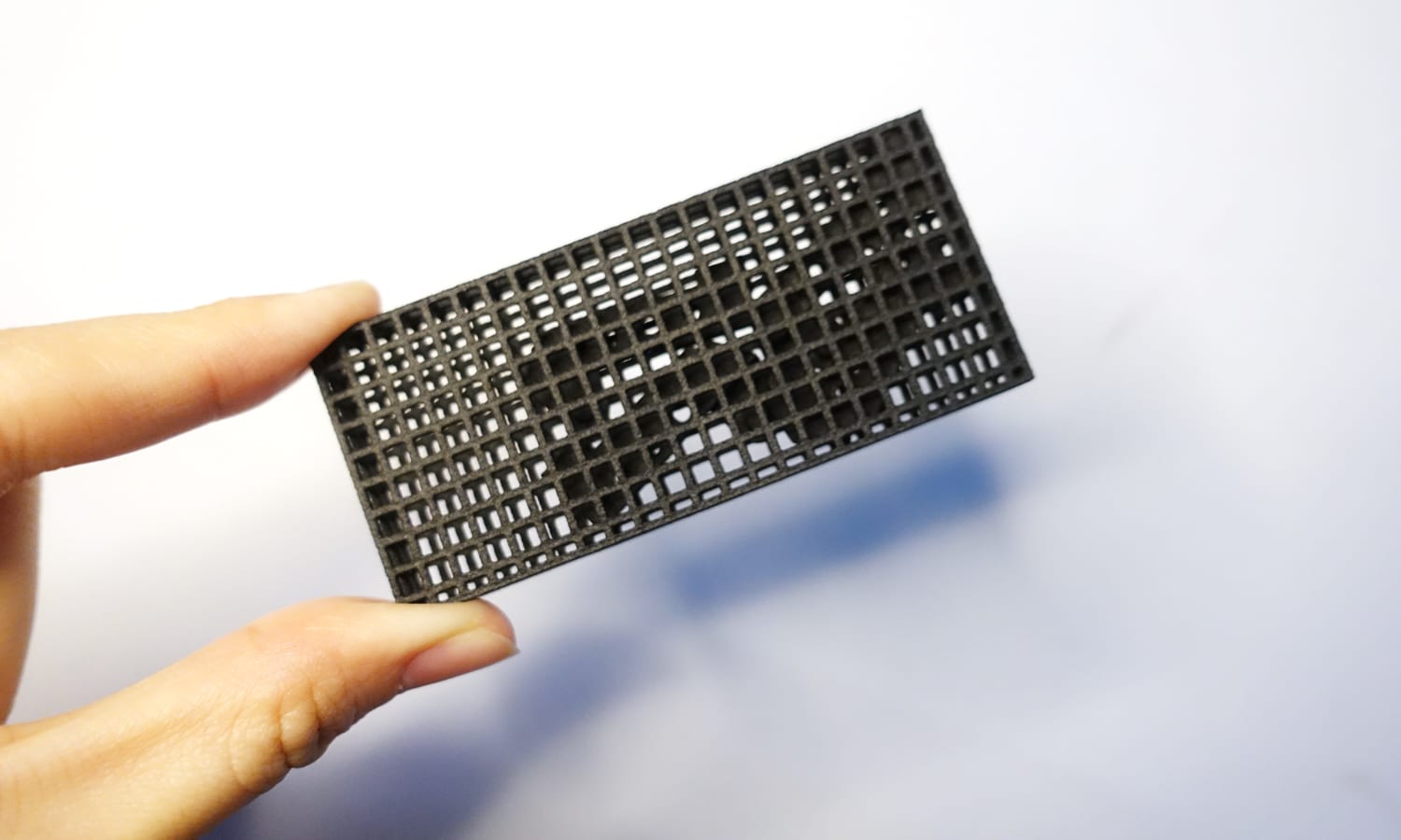 SLS 3D Printed Small Nylon Pieces Packaged with a Cage - FacFox